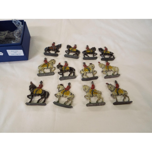 A box of assorted lead figures
