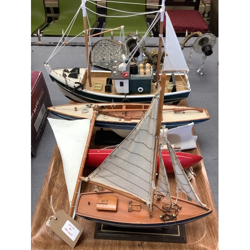Four scratch built model sailing boats