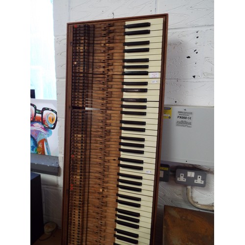 A wall hanging piano feature