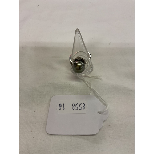 A 9ct white gold ring inset with large black Tahitian pearl flanked by ...