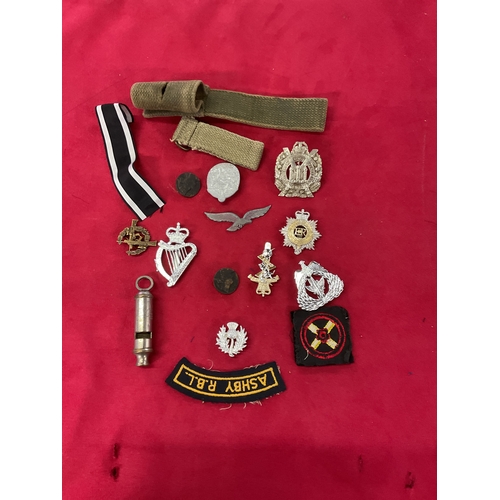 A bag of assorted badges, ribbons etc