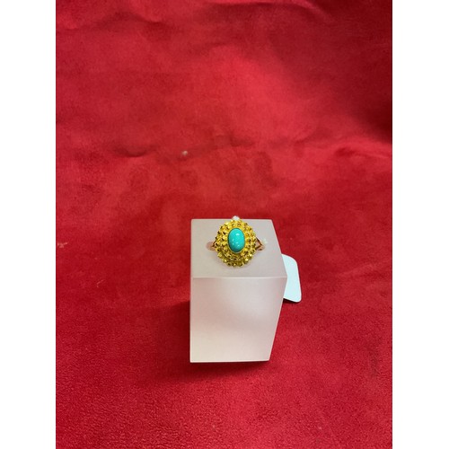 An 18ct Bahrain gold ring inset with turquoise, size N total weight 3.7 ...