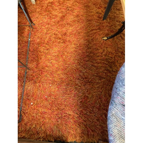 A good quality Jeff Banks orange coloured ground rug 70” x 96”