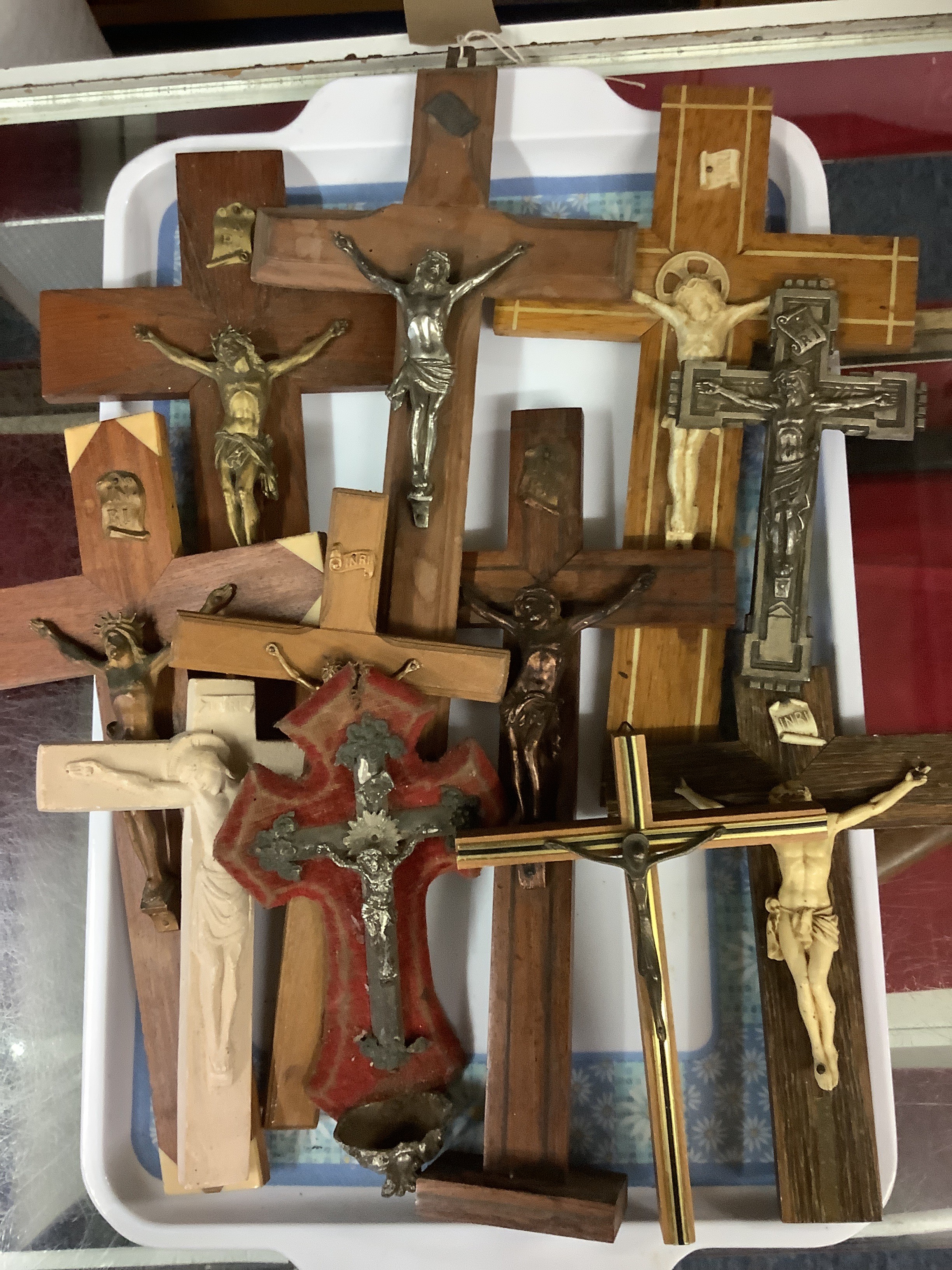 A large selection of wooden crucifixes