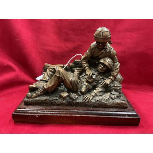 A Phoenix World Reproductions resin Army medical figure on a wooden base