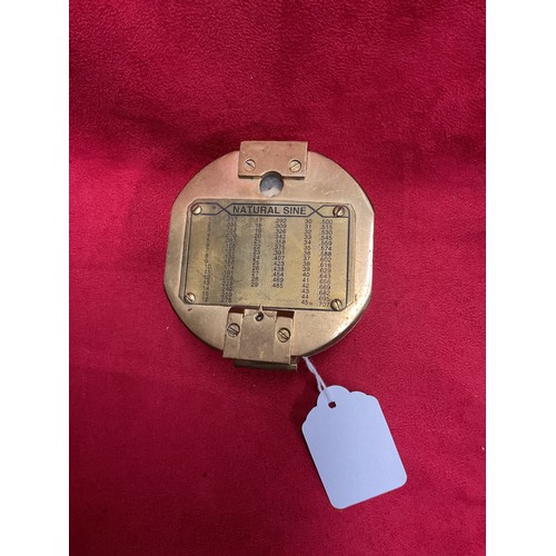 A vintage brass Brunton style Natural Sine compass