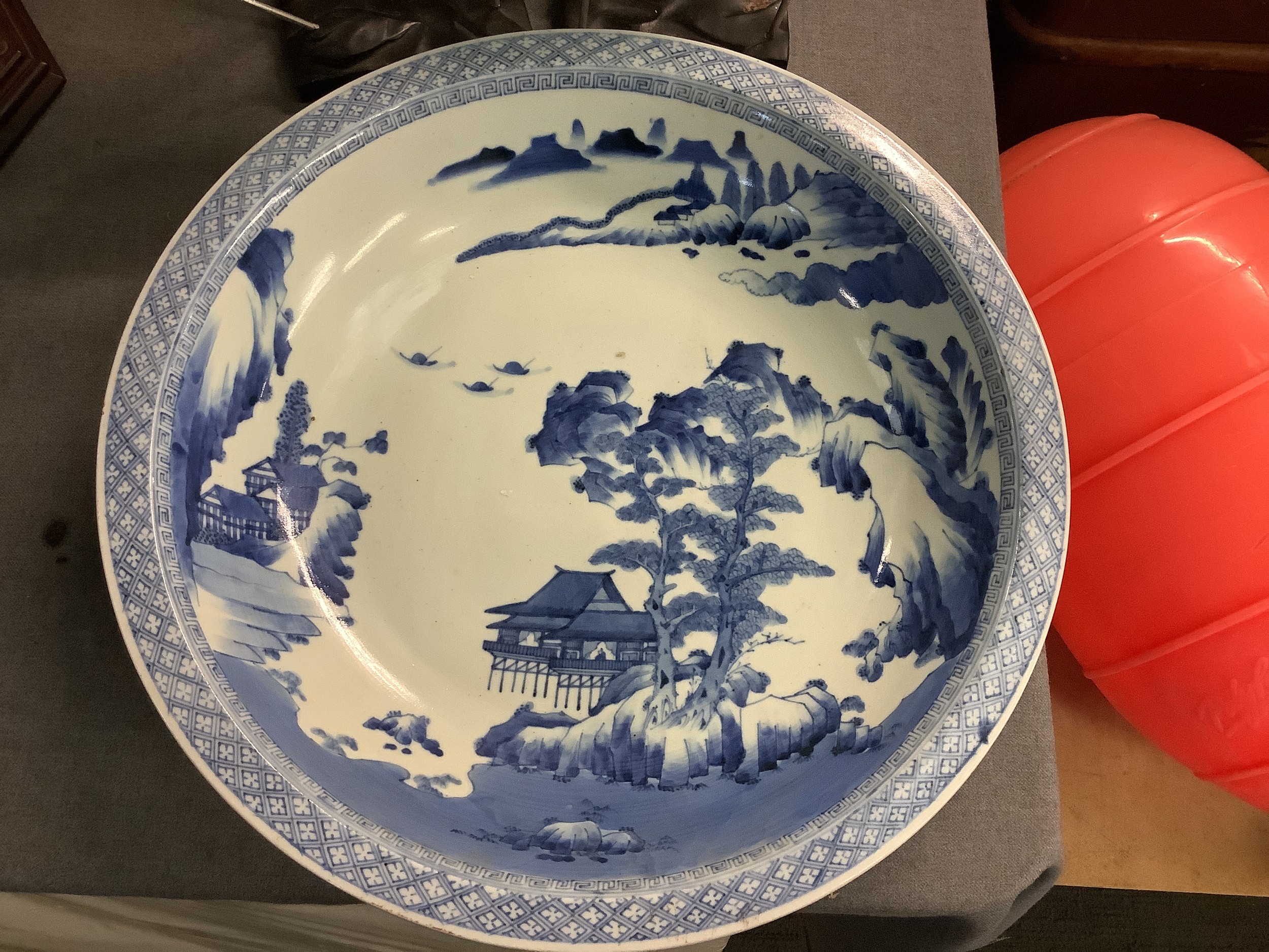 A large Japanese blue and white shallow bowl with pagoda decoration 16 ...