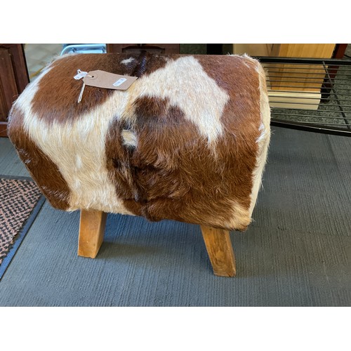 A vintage cow skin stool