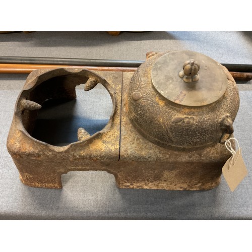 A vintage Japanese cast iron tea making chagama vessel with stand