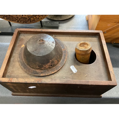 A wooden framed cast iron Japanese chagama tea making vessel