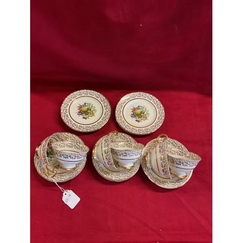A vintage Lubern part tea-set with 18ct gold banding and fruit decoration