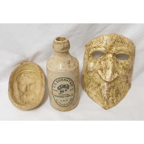 CC Dornat & Co. Barnstaple pottery dug bottle, composition mask ...