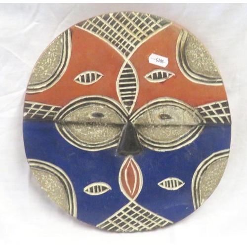 Circular African Wall Mask painted in terracotta & blue approx. 30cm dia.