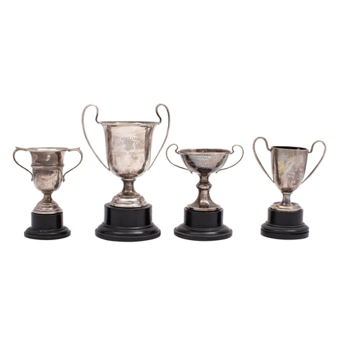 Four small silver twin-handled trophy cups (various dates and makers ...