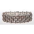 D. Shackman & Sons. A mid-century modernist silver bracelet, an ...