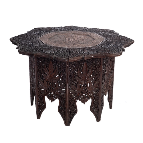 An Anglo Burmese carved hardwood and copper topped occasional or ...