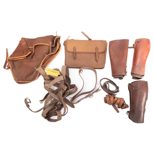 A collection of early 20th century brown leather gaiters and belts ...