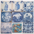 A group of eight blue and white Delft tiles, transfer printed with ...