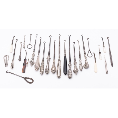 A mixed lot of silver and steel button hooks including; thirteen silver ...