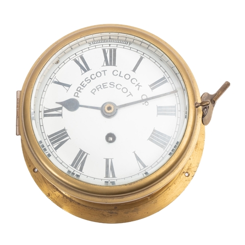 An early 20th century brass bulkhead clock, maker Prescot Clock Co. the ...
