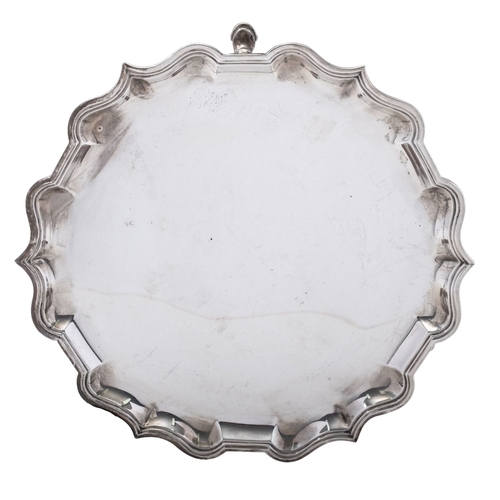 An Edwardian silver salver, of shaped circular outline, with... | Barnebys