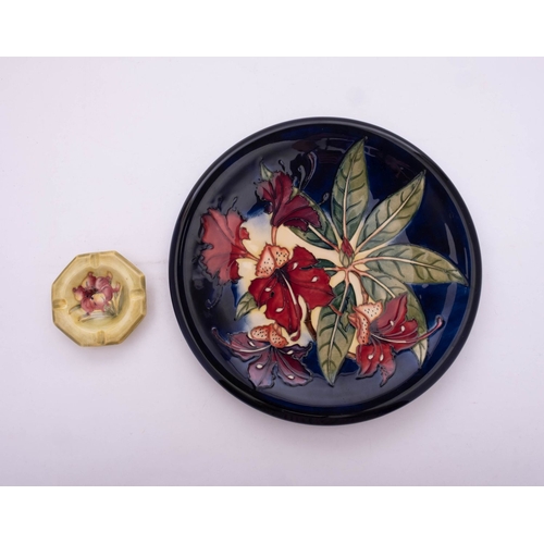 A large Moorcroft pottery plate tube lined in the Simeon pattern after ...