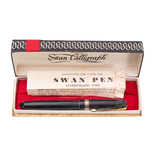 A Mabie Todd Swan Calligraph fountain pen. In black with gold trim and ...