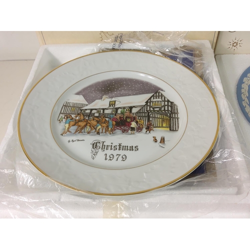 4 boxed collectors plates