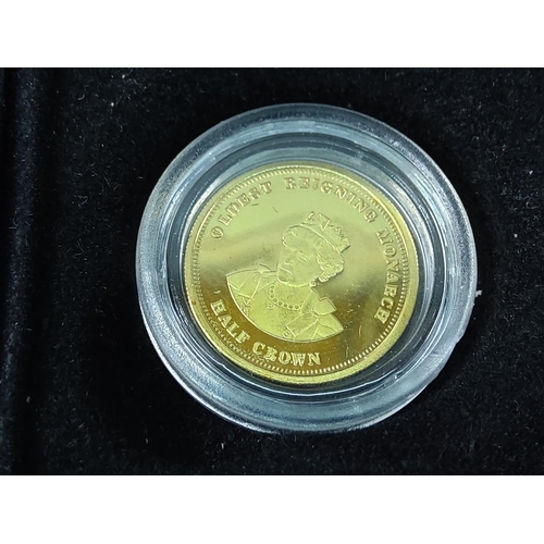 Cased set of 12 gold Royal House of Windsor gold coins and a plated £5 coin