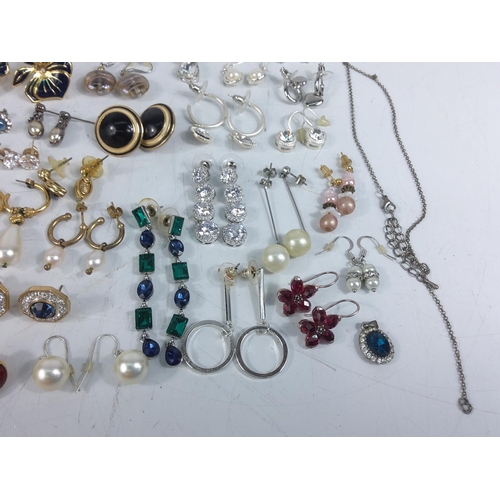 Earrings and jewellery including silver