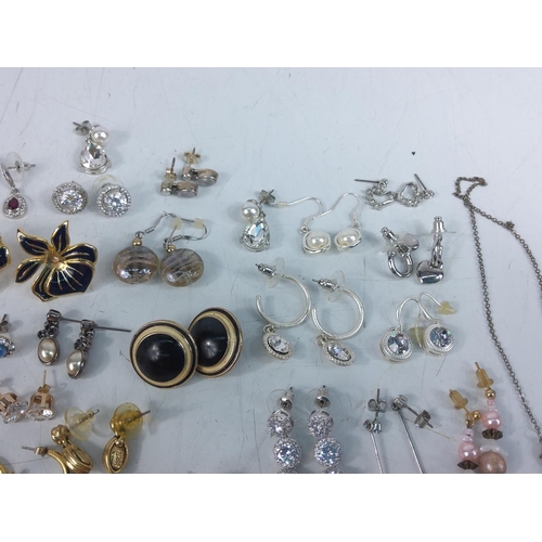 Earrings and jewellery including silver