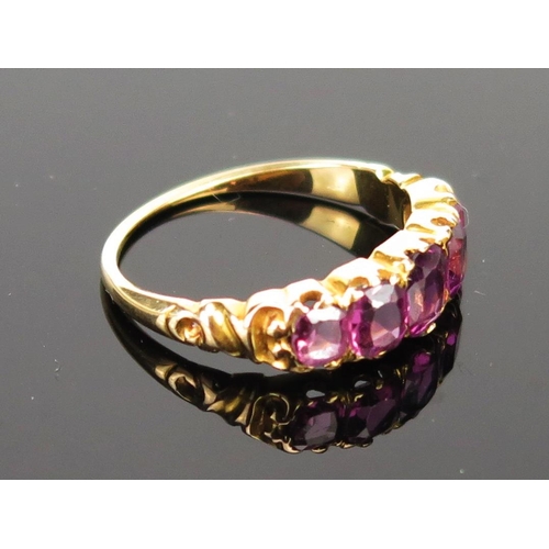 An Antique 'Amethyst' Paste Ring in an unmarked high carat gold setting ...