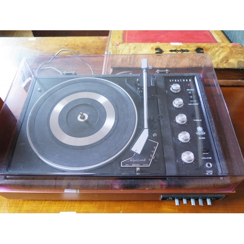 A Dynatron record player with in built radio and twin speakers.