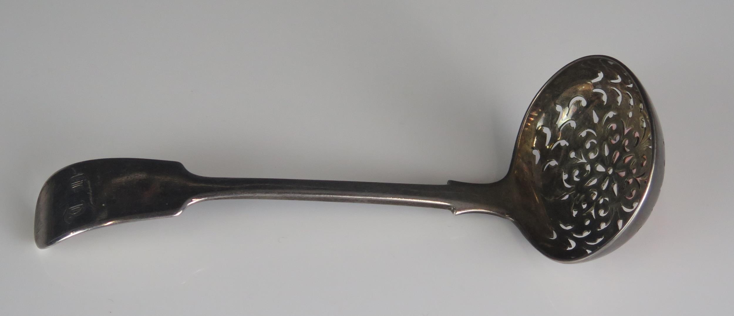 A Victorian provincial silver Fiddle pattern sifting spoon, maker ...
