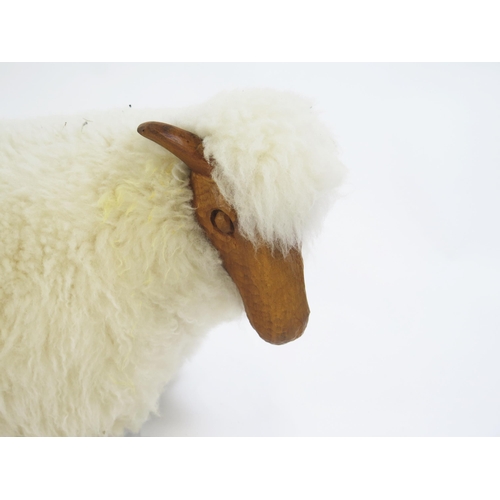 A foot stool to a design by John Neusinger in the form of a recumbent ...