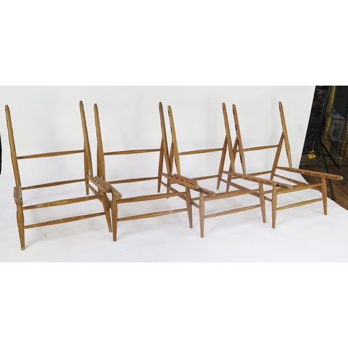 A set of four Ercol teak framed occasional chairs Model No 427, with padded backs and seats, (all la