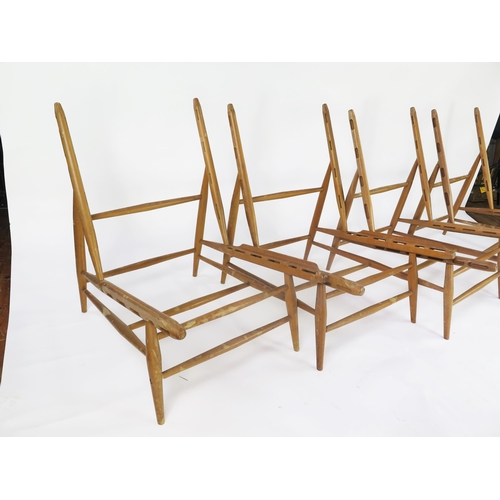 A set of four Ercol teak framed occasional chairs Model No 427, with padded backs and seats, (all la