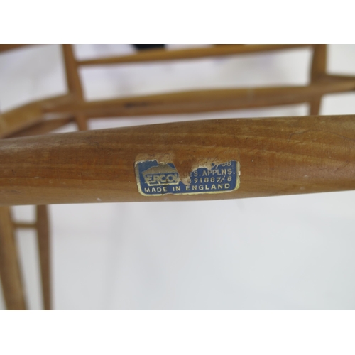 A set of four Ercol teak framed occasional chairs Model No 427, with padded backs and seats, (all la