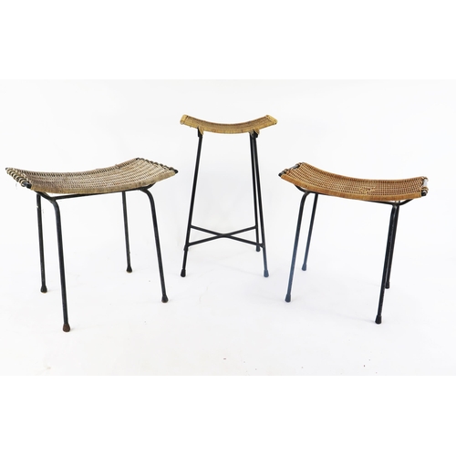 Three assorted cane and steel stools with curved seats. 64cm and 47cm ...