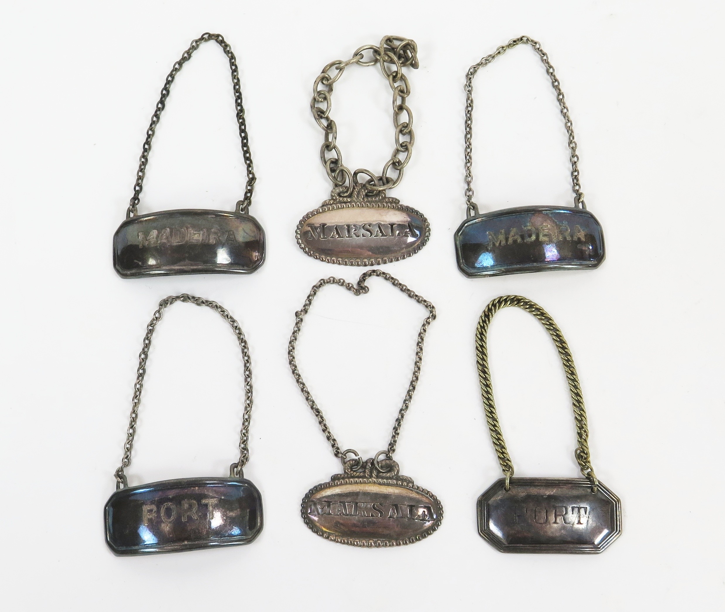 A collection of army issue plated spirit labels mostly bearing crows ...
