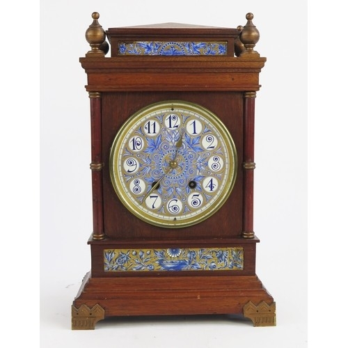A mahogany mantel clock of rectangular outline with shallow domed top ...