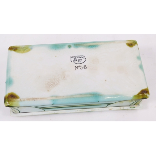 A Minton Secessionist earthenware rectangular box and cover with linear ...