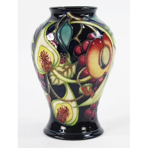 A Moorcroft pottery vase, with Queens Choice pattern design by Emma ...