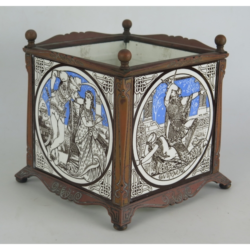 A Victorian metal plant holder with sides decorated with Minton tiles ...
