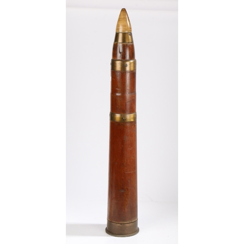 Wooden and brass model/drill round of a British 4 inch Naval Shell ...