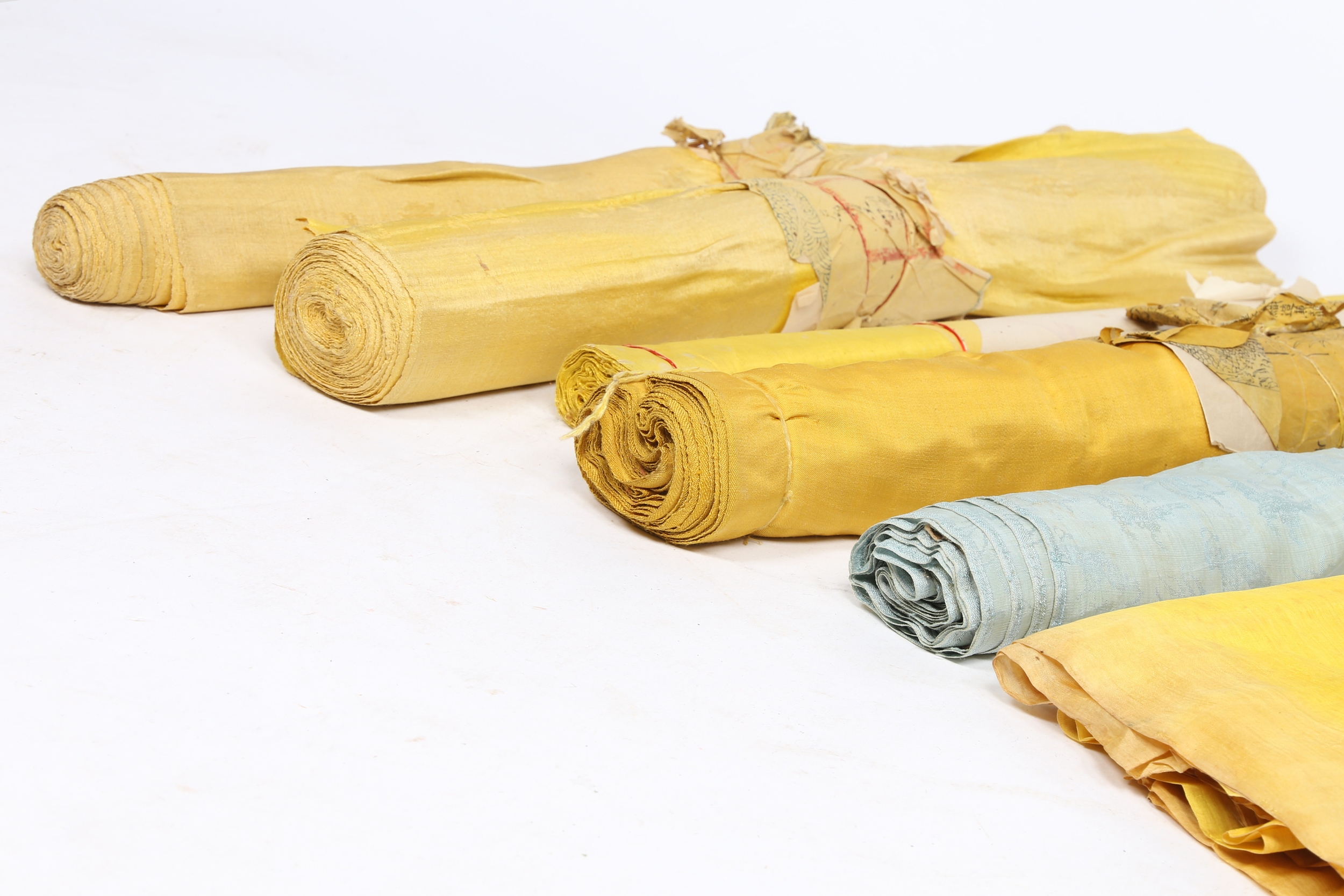 SIX CHINESE SILK FABRIC BOLTS, QING DYNASTY. Five with a yellow ground ...