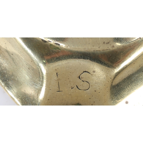 A GEORGE I BRASS CANDLESTICK, CIRCA 1720. having a plain socket above a ...