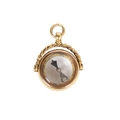 ANTIQUE 18CT GOLD SPINNING COMPASS FOB. A solid chain C-shaped frame ...