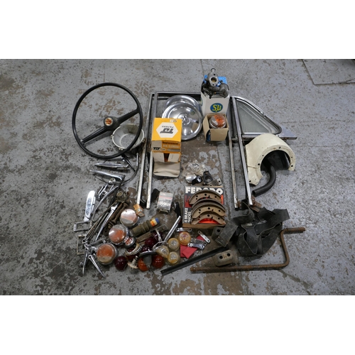 A quantity of Morris Minor 1000 spare parts: front and rear lamp lenses ...