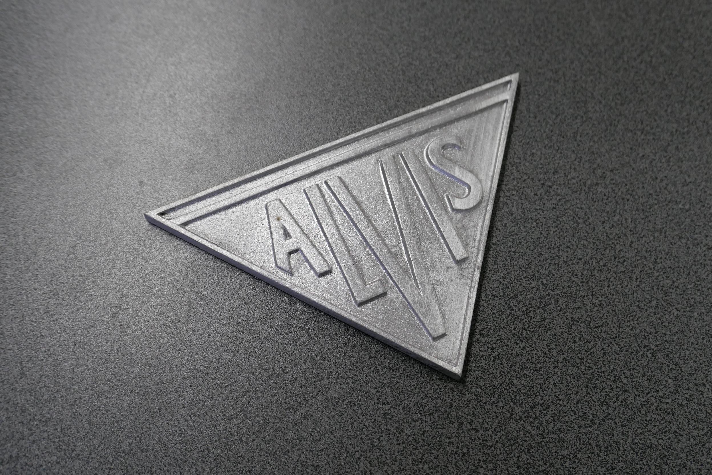 A cast aluminium Alvis logo, 8 inches wide
